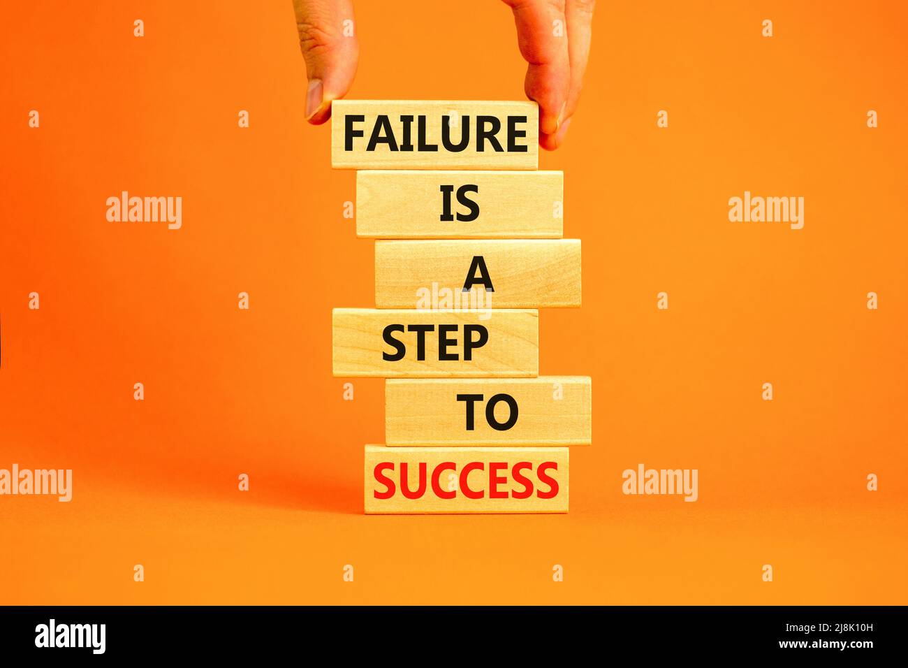 Failure or success symbol. Wooden blocks with words A failure is a step ...