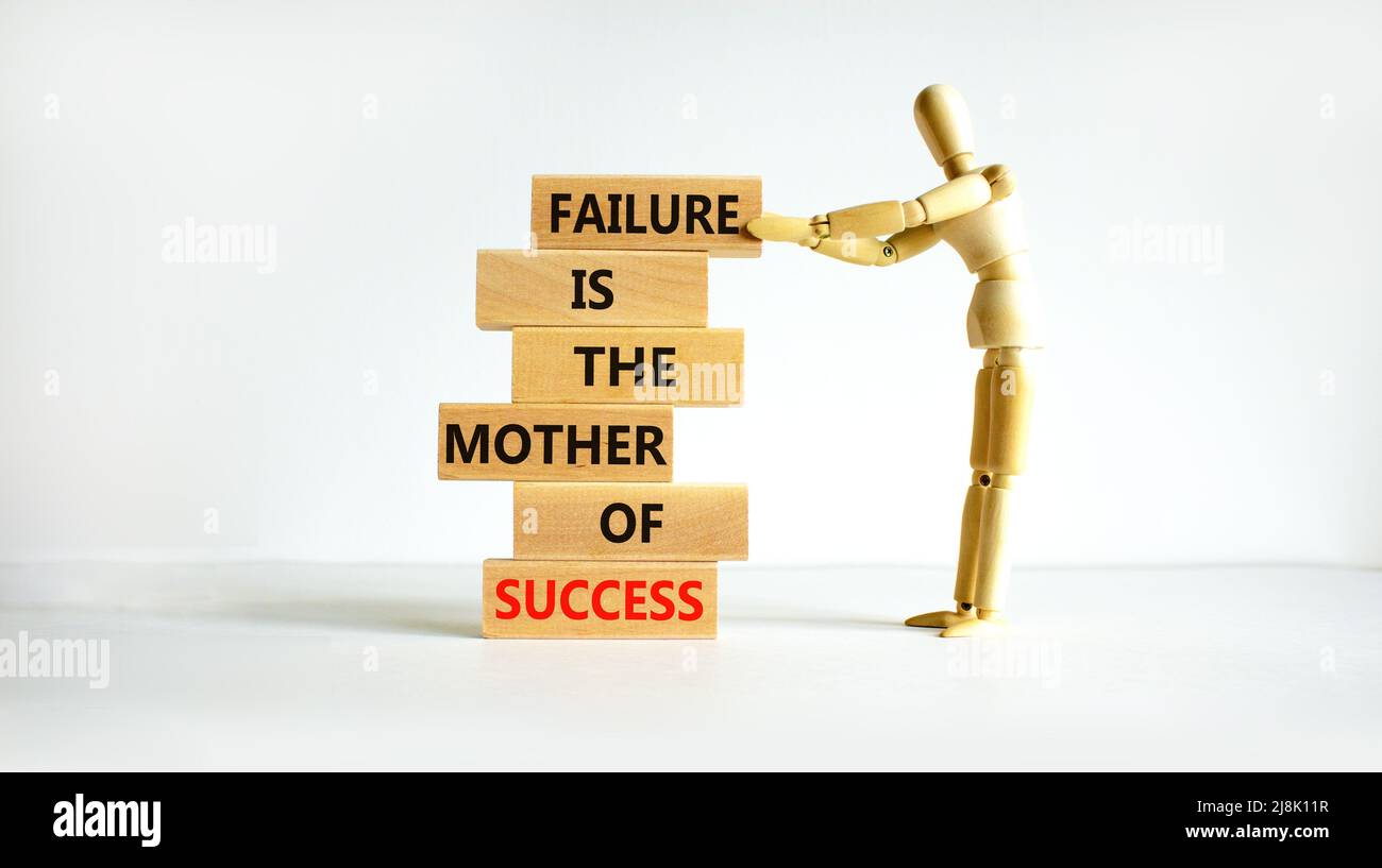 Failure or success symbol. Wooden blocks with words A failure is the ...