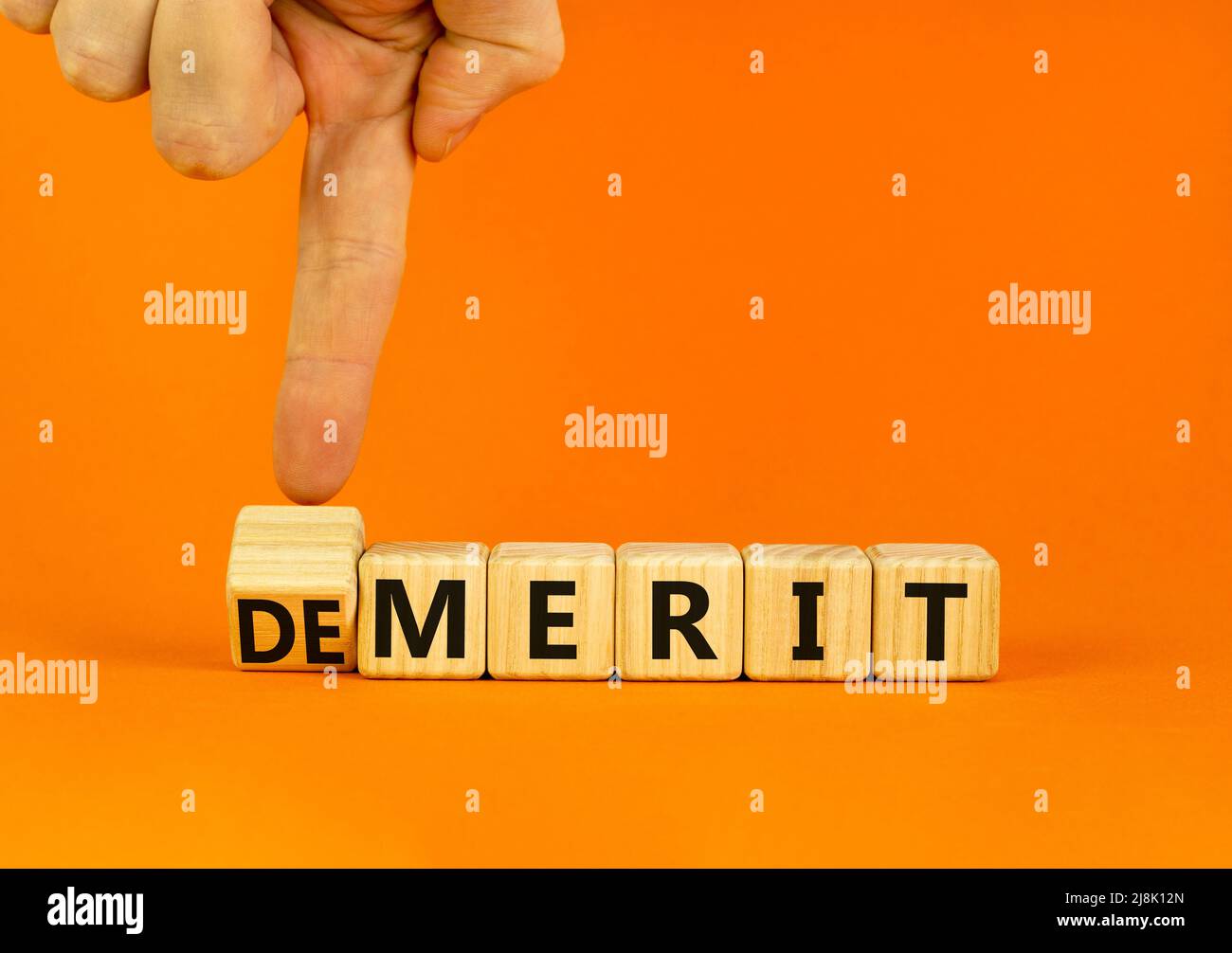 Demerit or merit symbol. Businessman turns wooden cubes and changes the ...