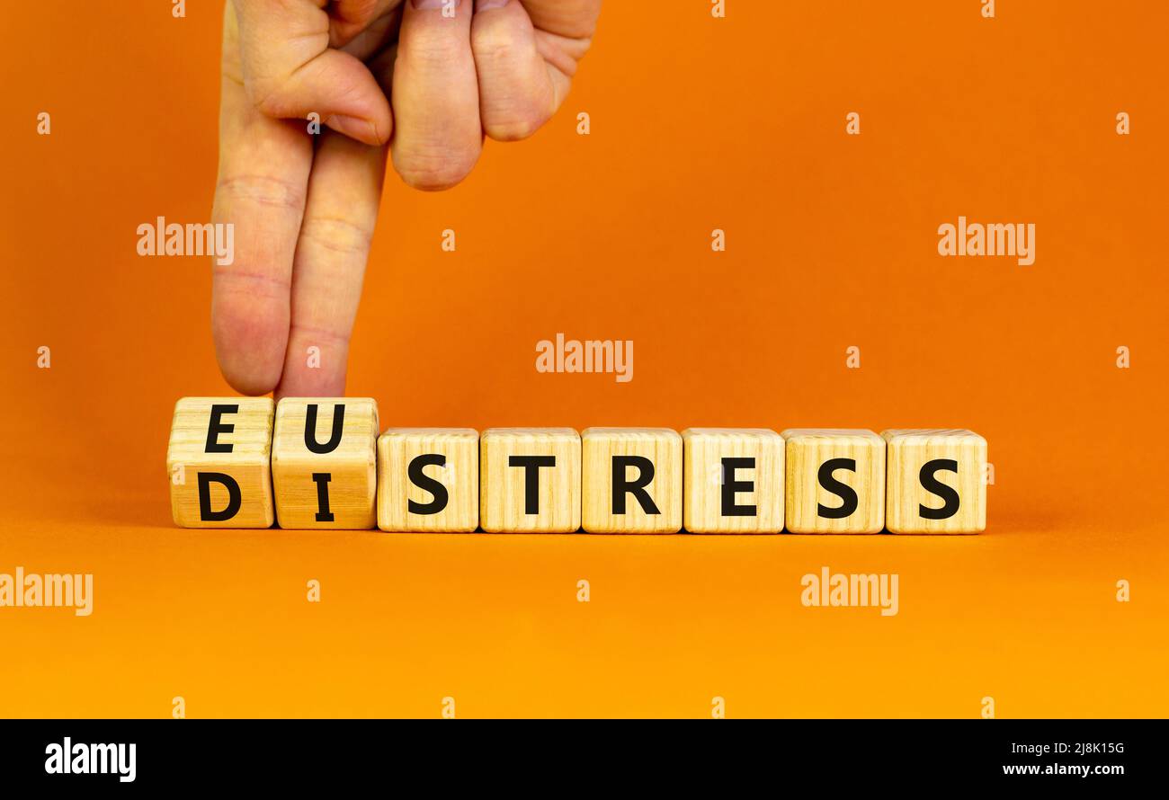 Eustress or distress symbol. Psychologist turns cubes and changes the ...