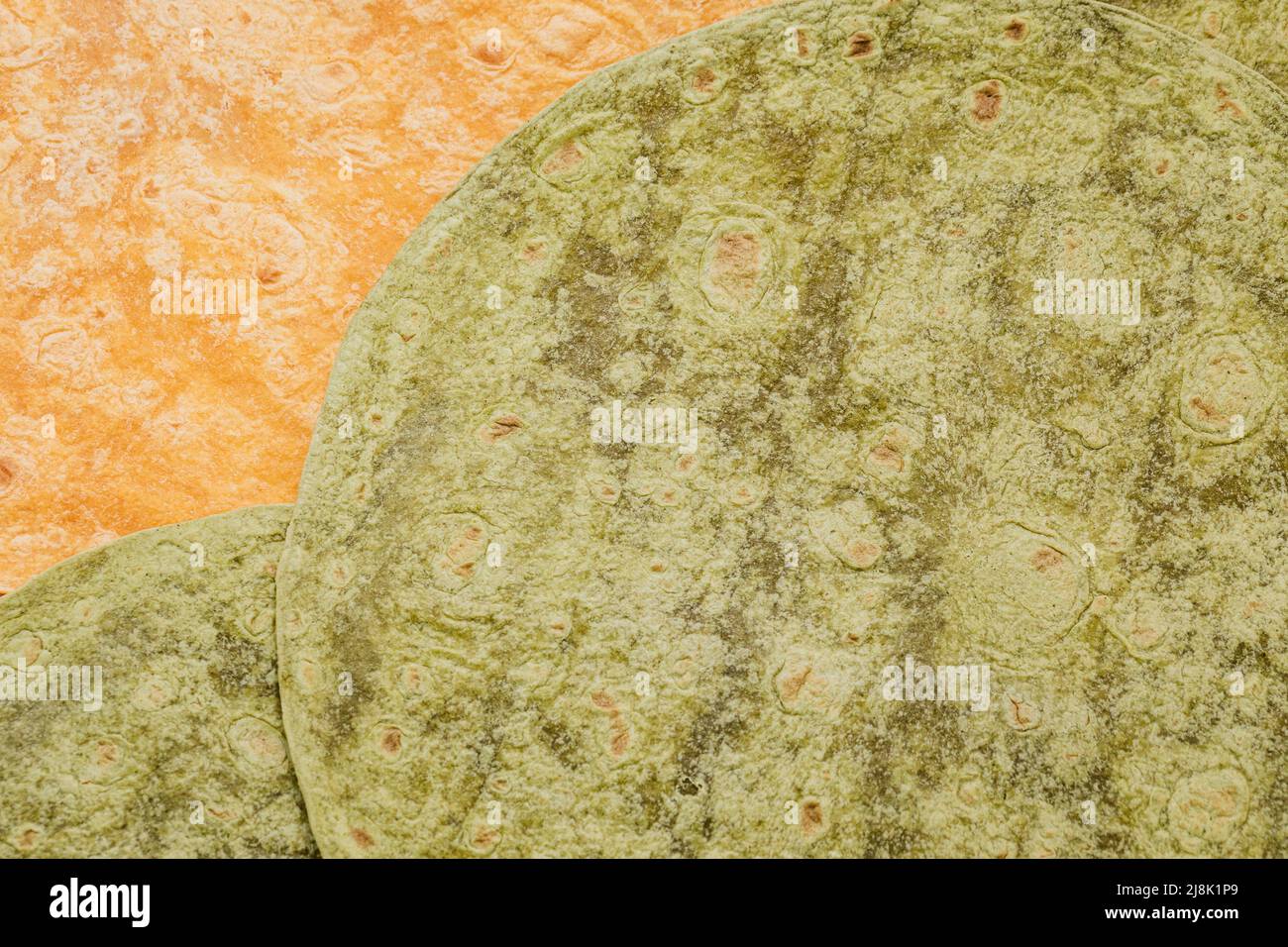 Tomato, spinach flavored wheat tortilla wraps. Spanish or Mexican ...