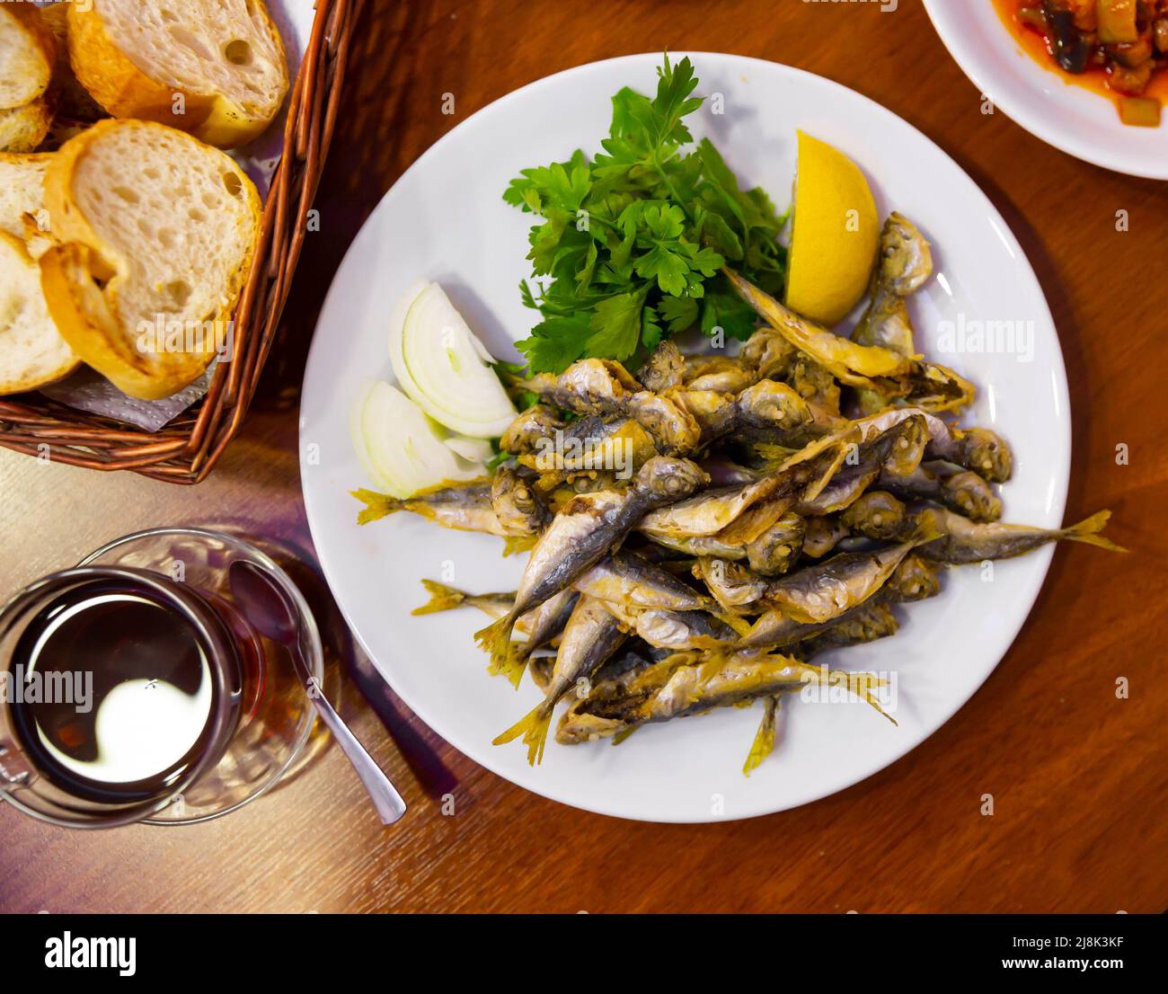 Delicious fried red mullet fish with parsley and lemon Stock Photo - Alamy