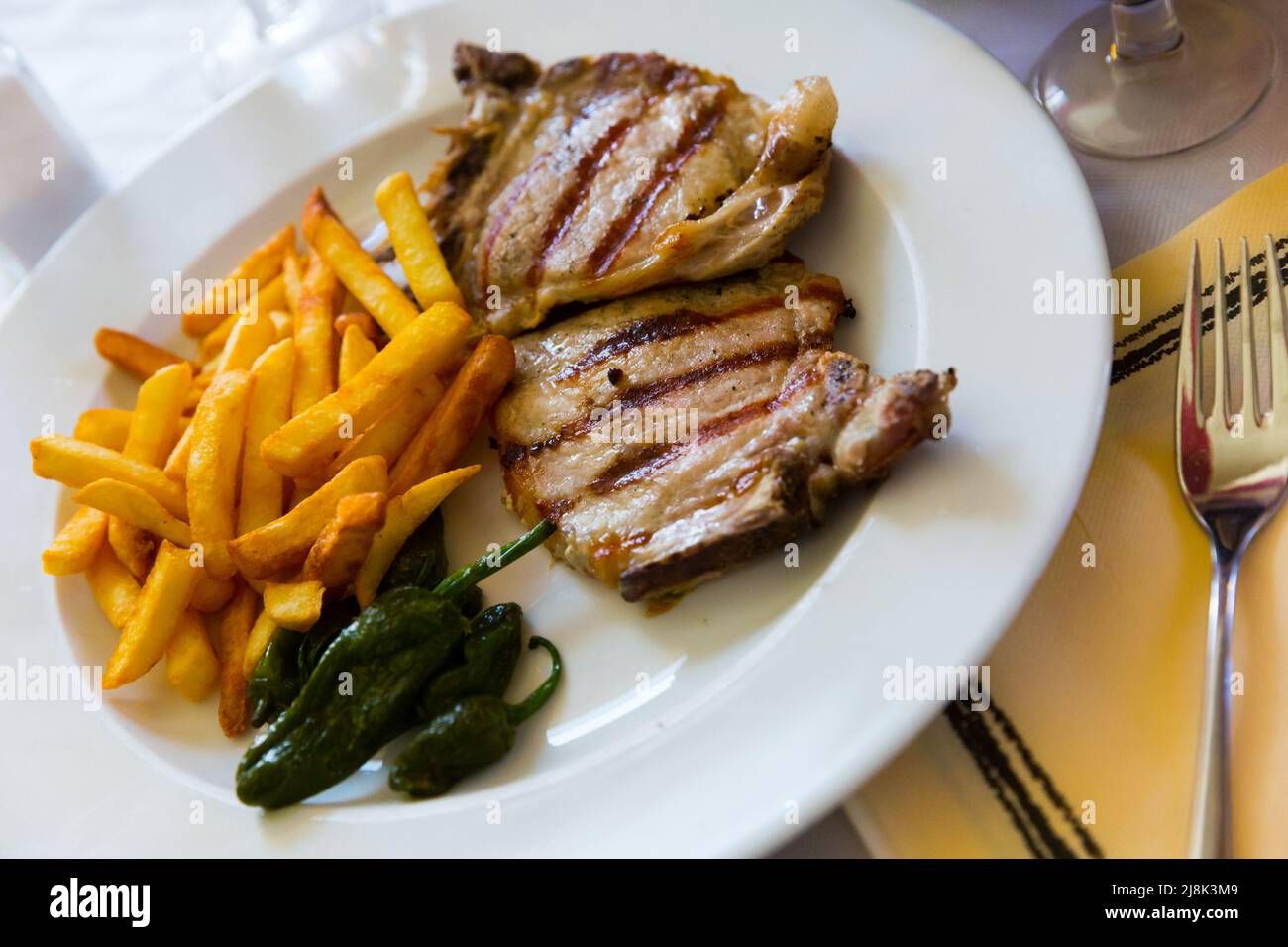 Grilled cutlet with French fries Stock Photo - Alamy