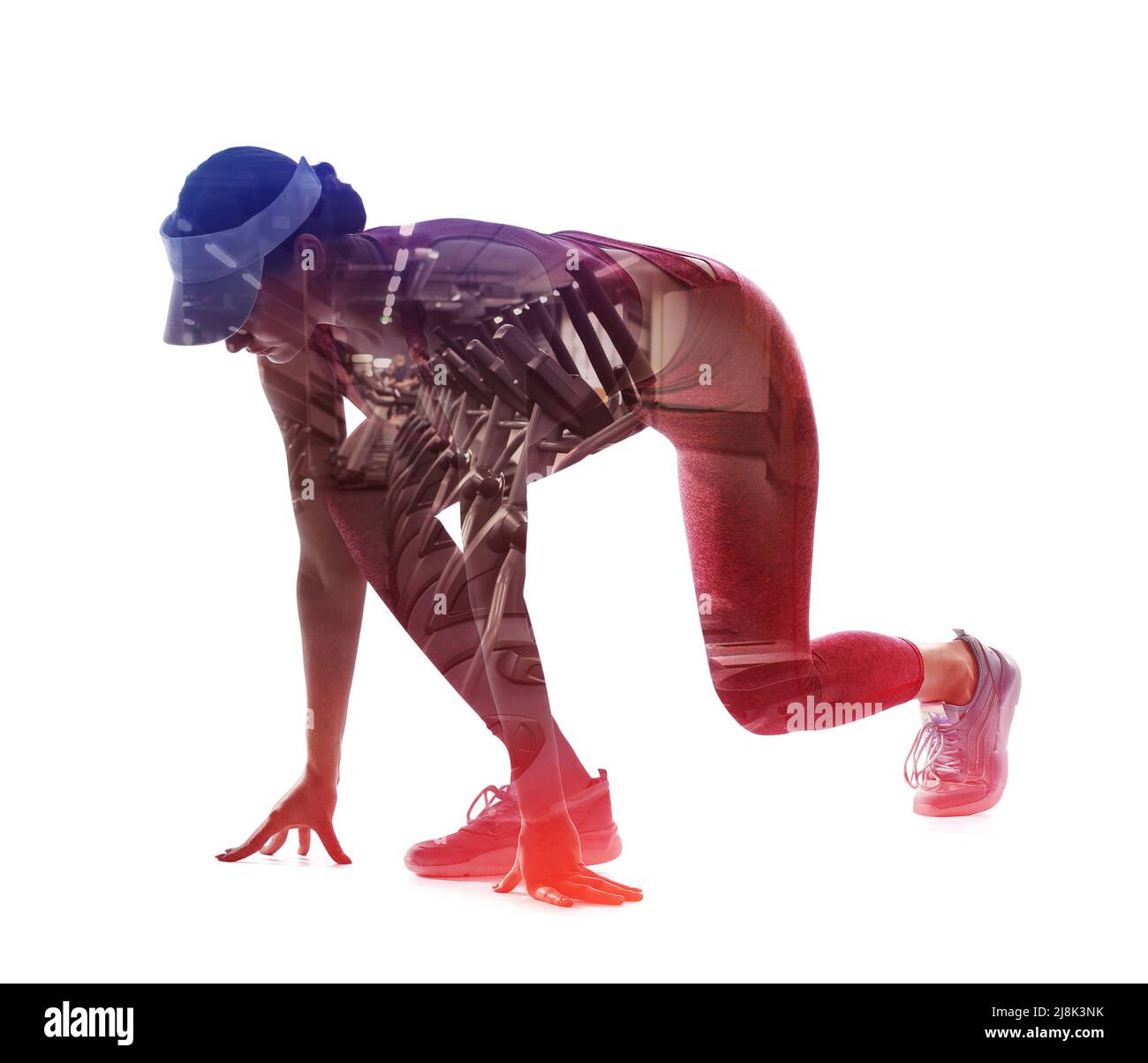 Double exposure of female runner in crouch start position and modern ...