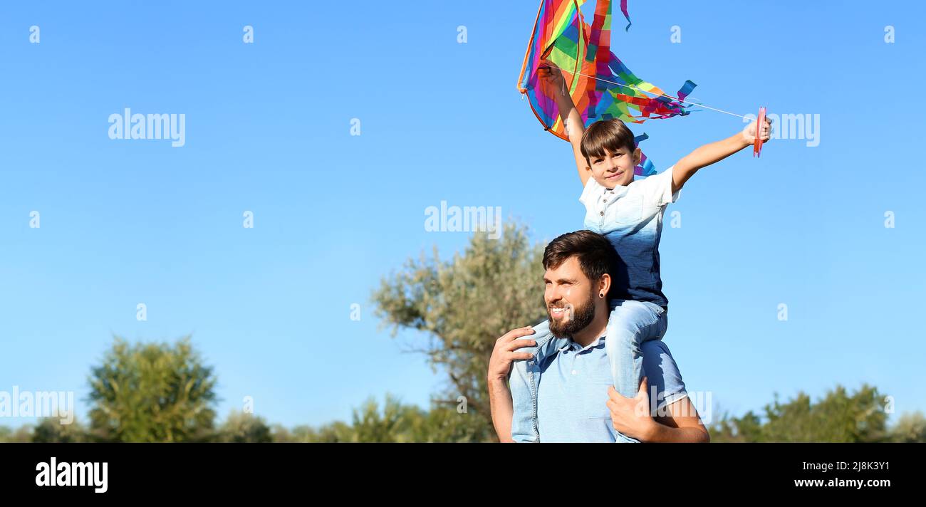 Happy father and his little son flying kite in park Stock Photo - Alamy