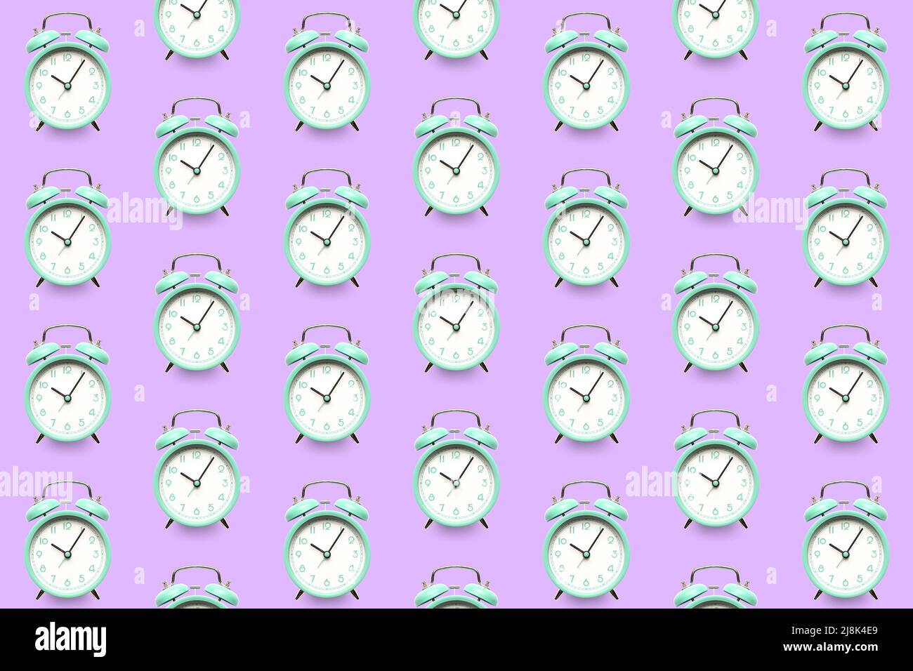 Many alarm clocks on lilac background. Pattern for design Stock Photo ...