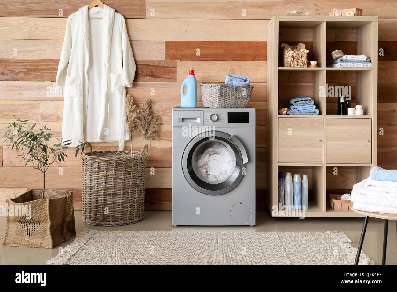 Interior of home laundry room with modern washing machine Stock Photo ...