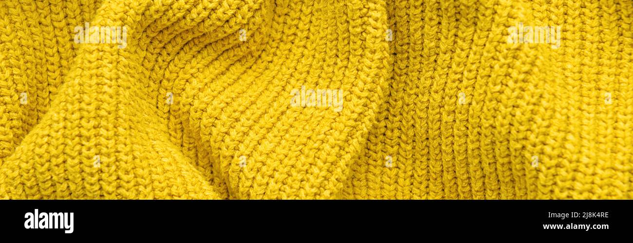 Texture of yellow knitted fabric as background. Banner for design Stock ...