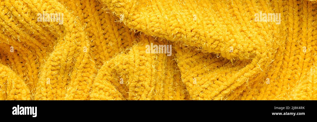 Texture of yellow knitted fabric as background. Banner for design Stock ...