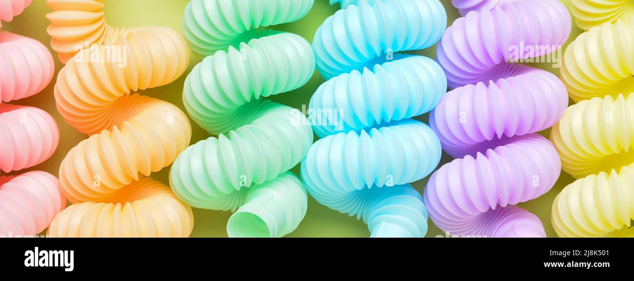 Different colorful Pop Tubes, top view. Banner for design Stock Photo ...