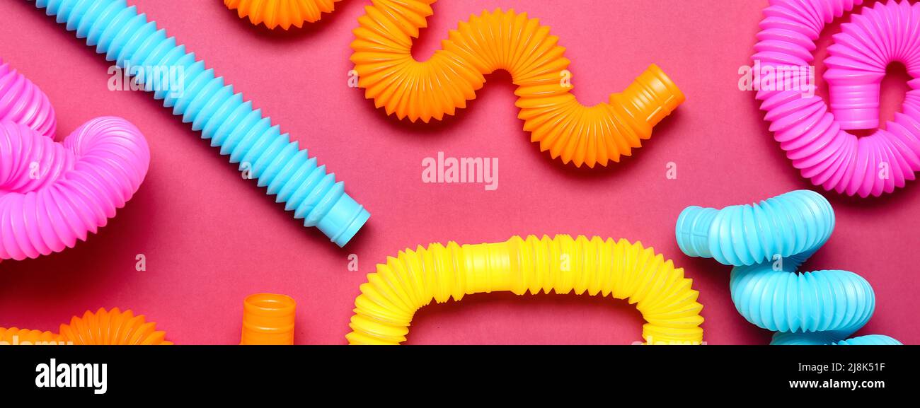 Pop Tubes on pink background. Banner for design Stock Photo - Alamy