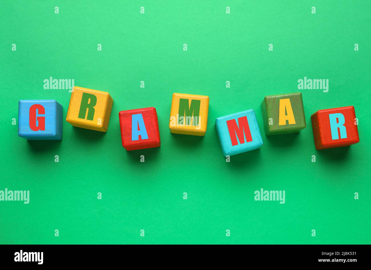 Word GRAMMAR made of cubes on green background Stock Photo - Alamy
