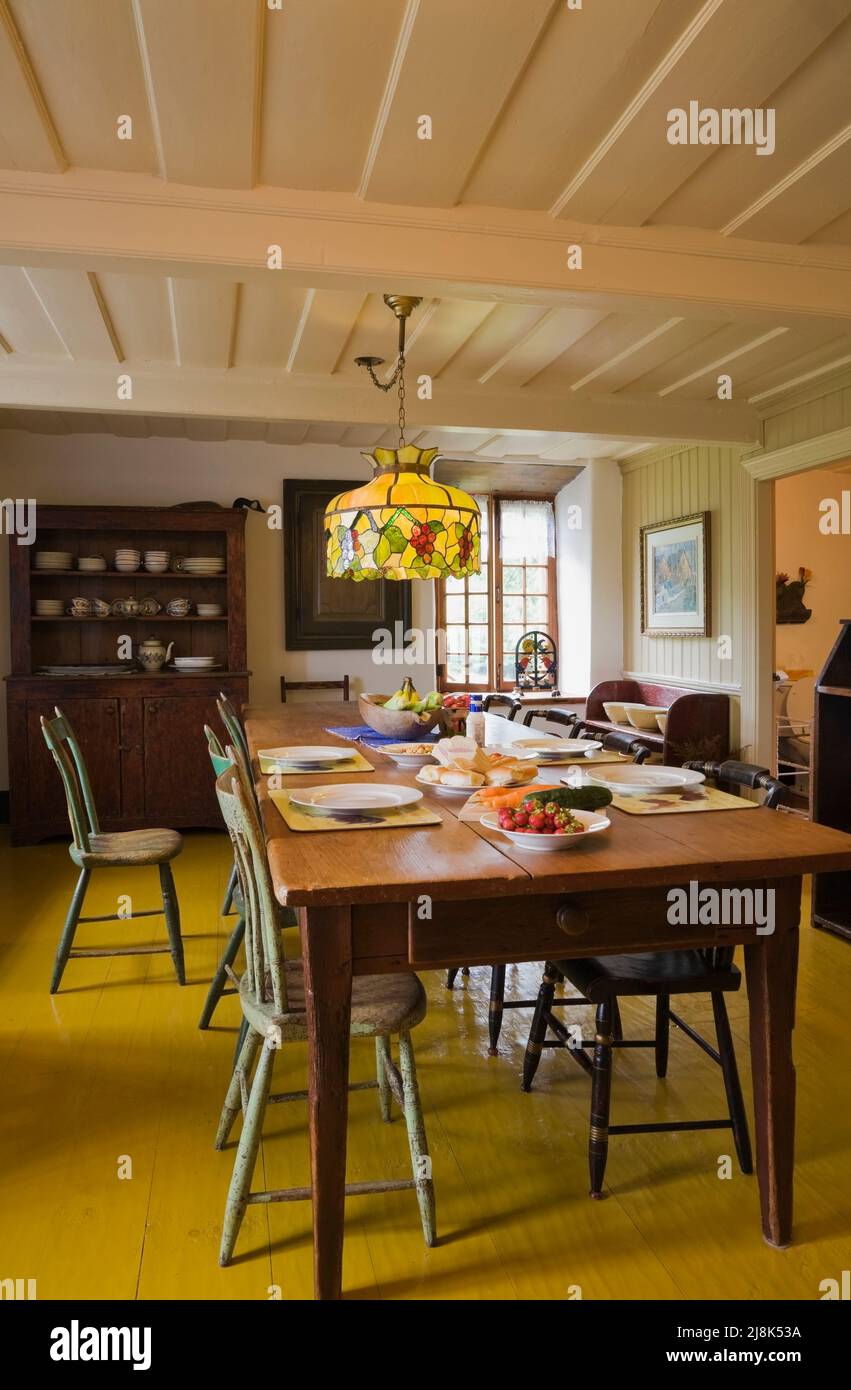 Antique dining table and chairs with lunch set for four in kitchen ...