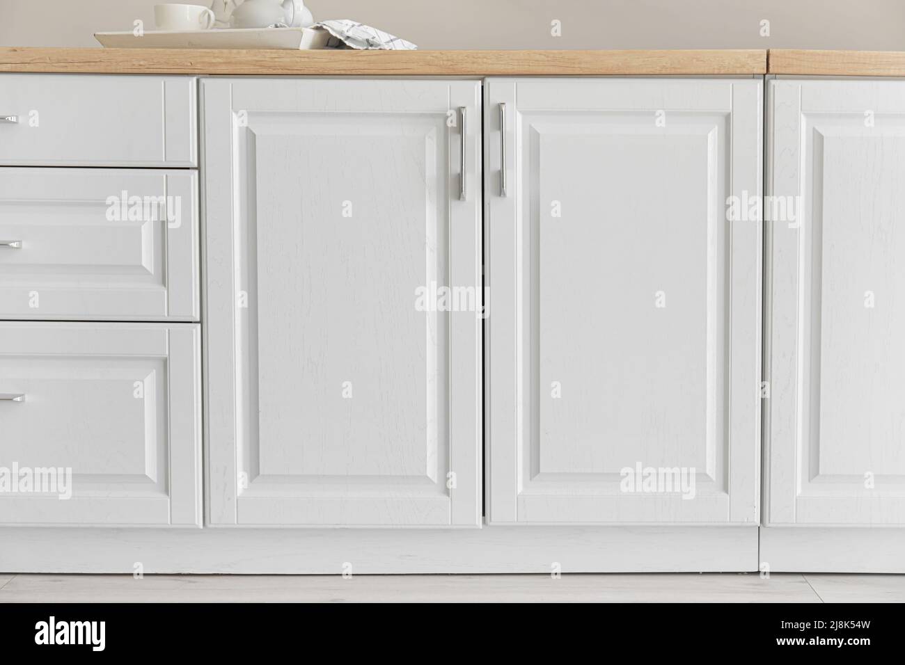 White counters in modern kitchen Stock Photo - Alamy