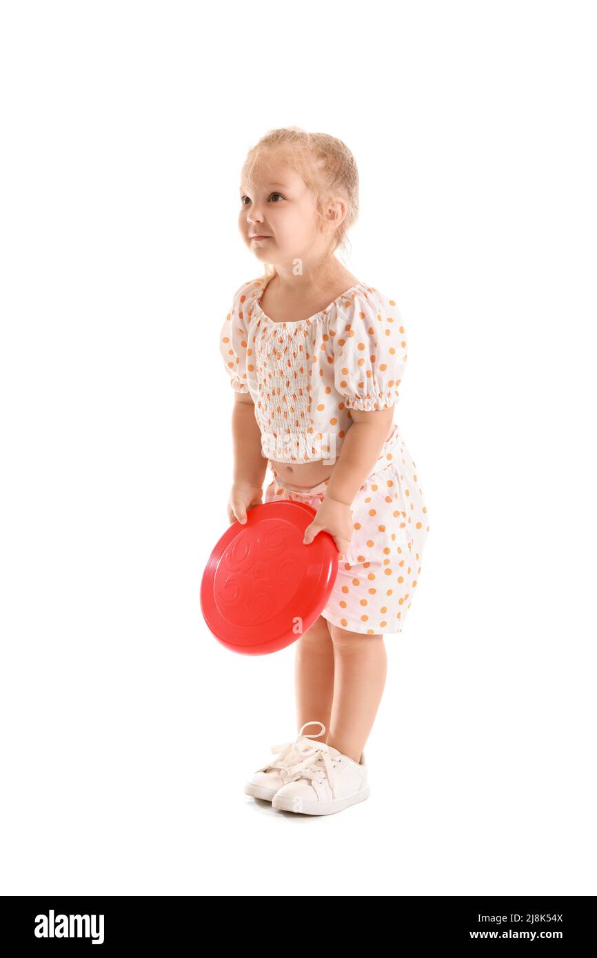 Cute little girl playing frisbee on white background Stock Photo - Alamy