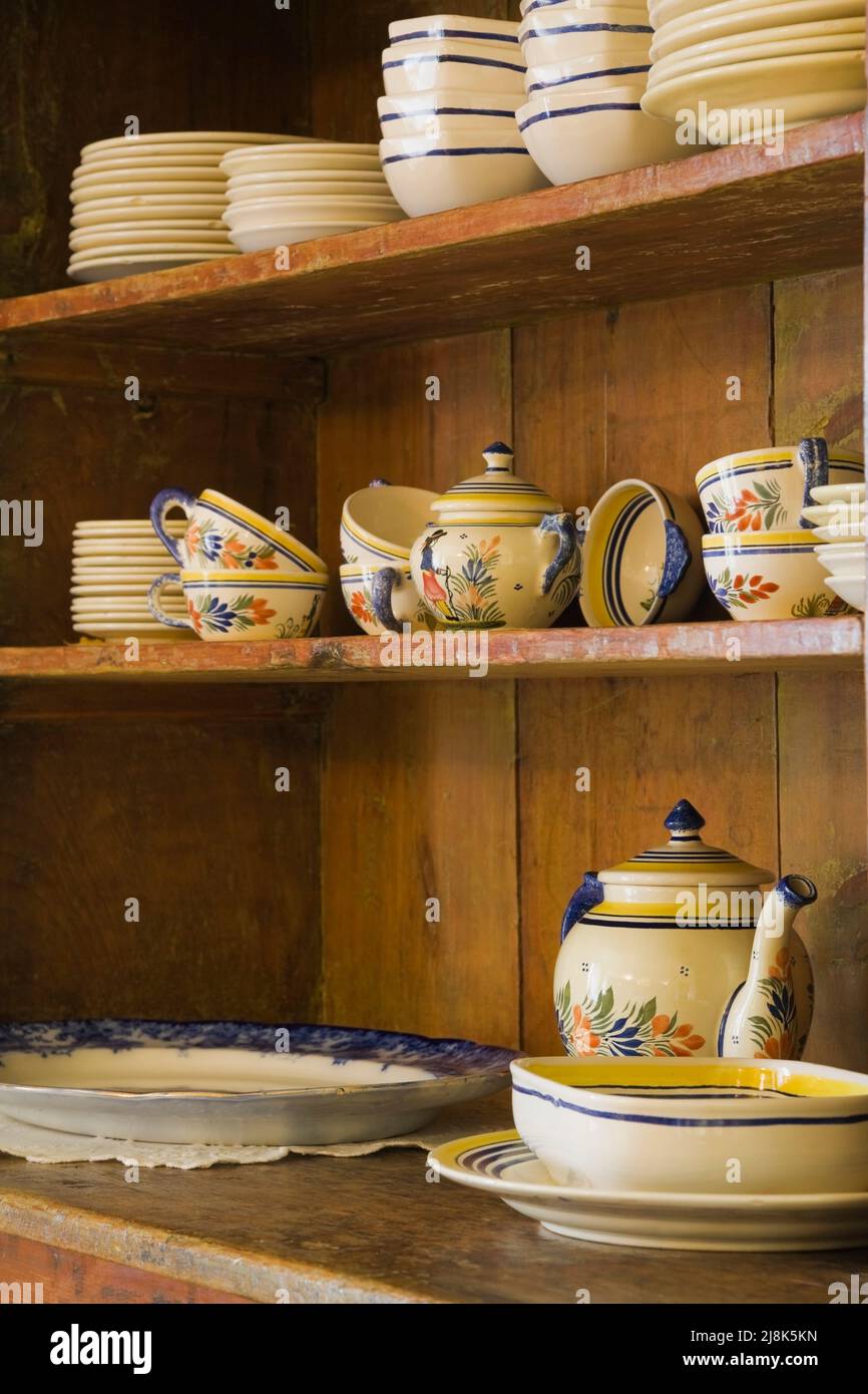 Antique crockery buffet with fine dishes in kitchen inside old circa ...