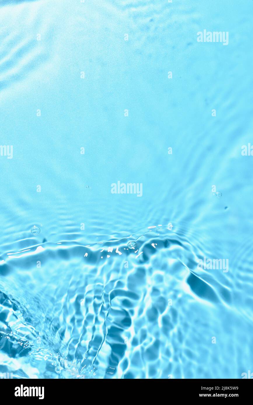 Texture of water with ripples on blue background, closeup Stock Photo ...