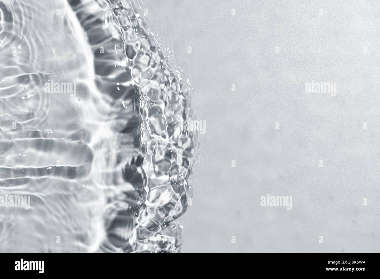 Texture of water with ripples on light background, closeup Stock Photo ...