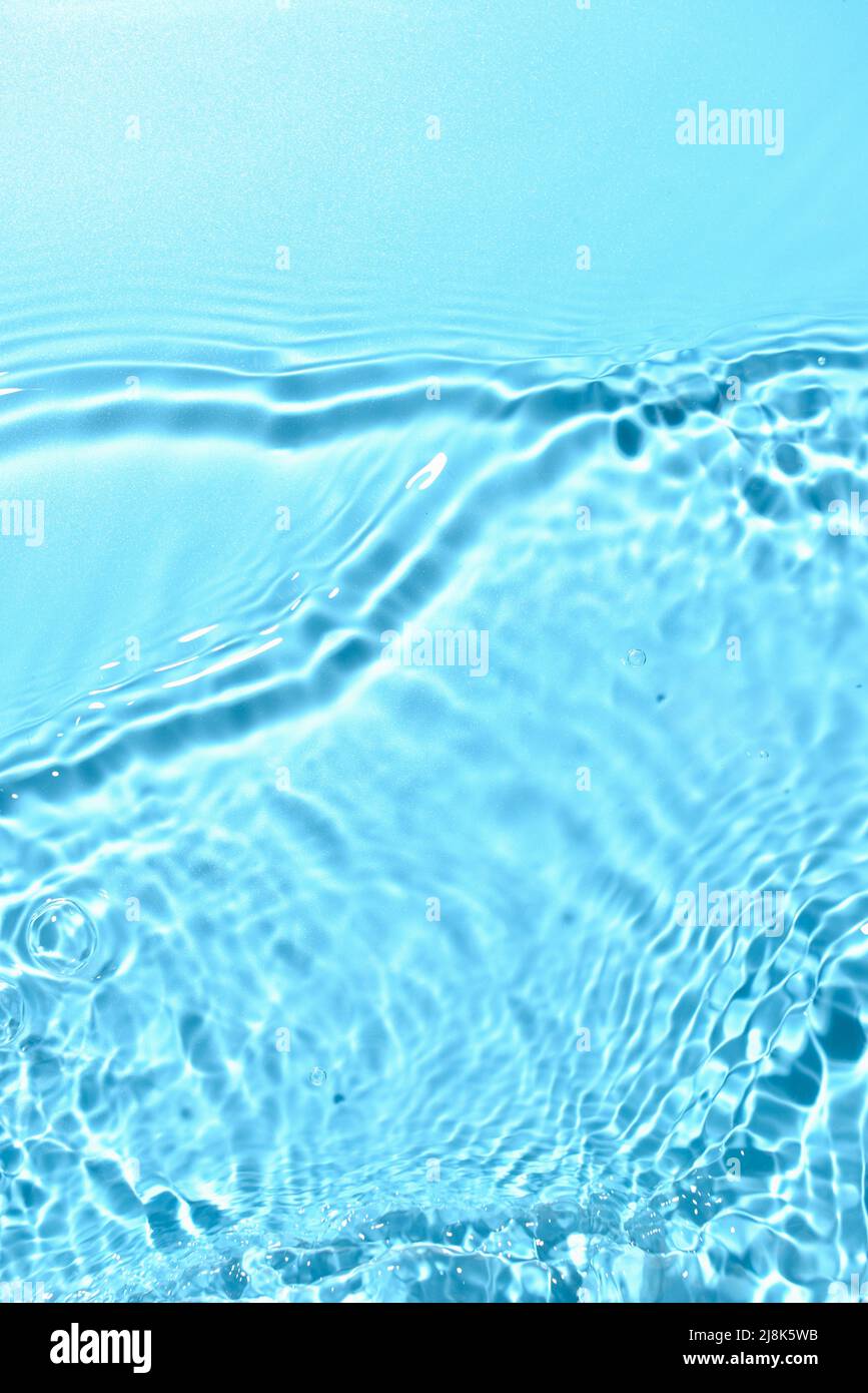 Texture of water with ripples on blue background, closeup Stock Photo ...