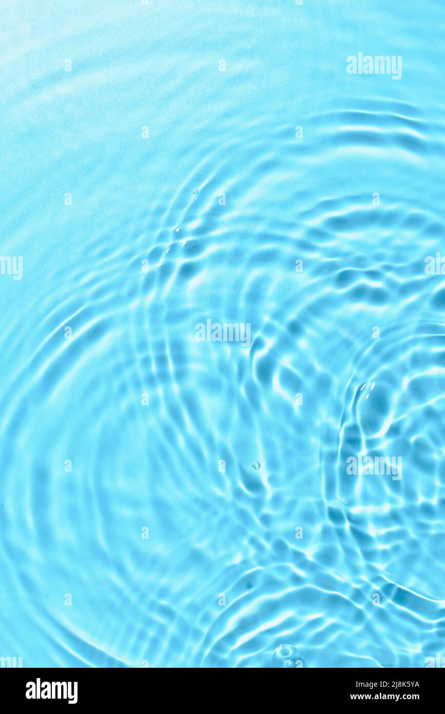 Texture of water with ripples on blue background, closeup Stock Photo ...