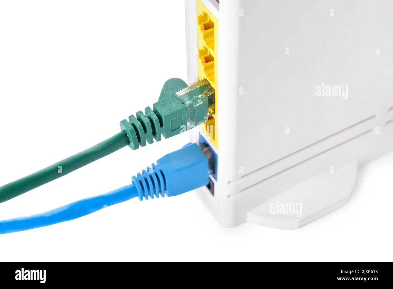 Modern wi-fi router and internet cables isolated on white background ...