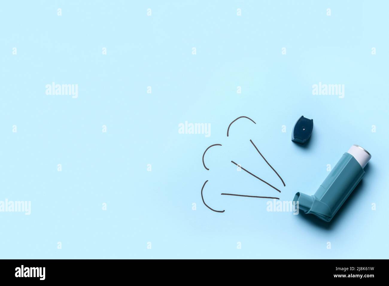 Composition with asthma inhaler on blue background Stock Photo - Alamy