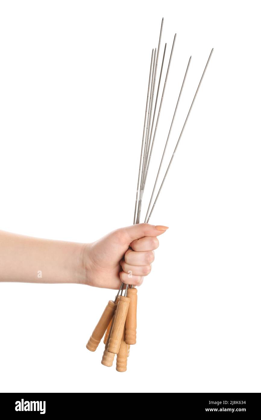 Female hand with wooden skewers on white background Stock Photo - Alamy