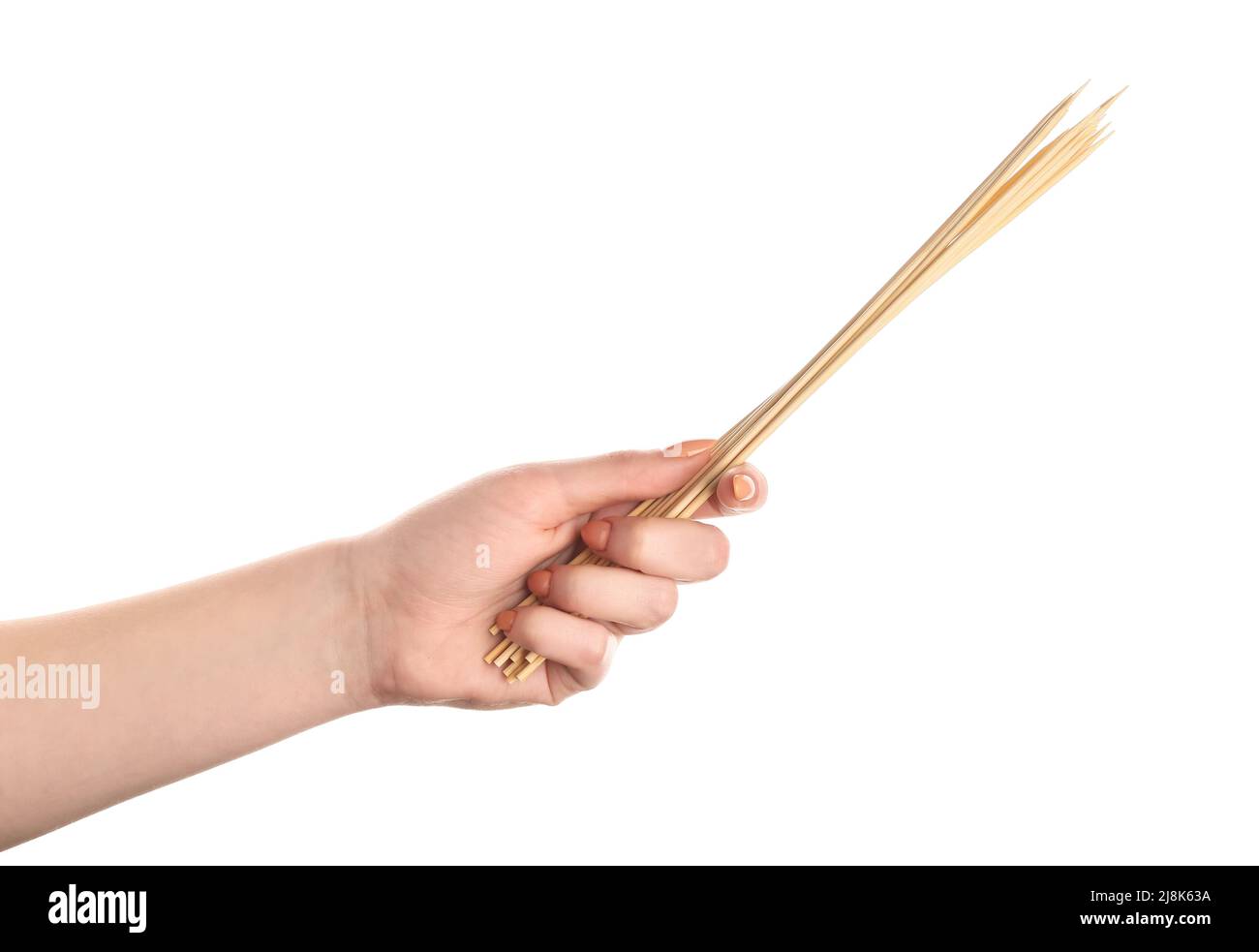 Female hand with wooden skewers on white background Stock Photo - Alamy