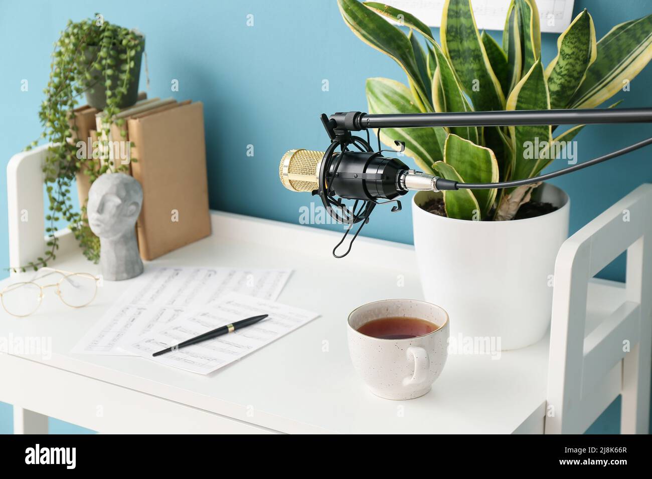 Stand with professional microphone near modern workplace of composer ...