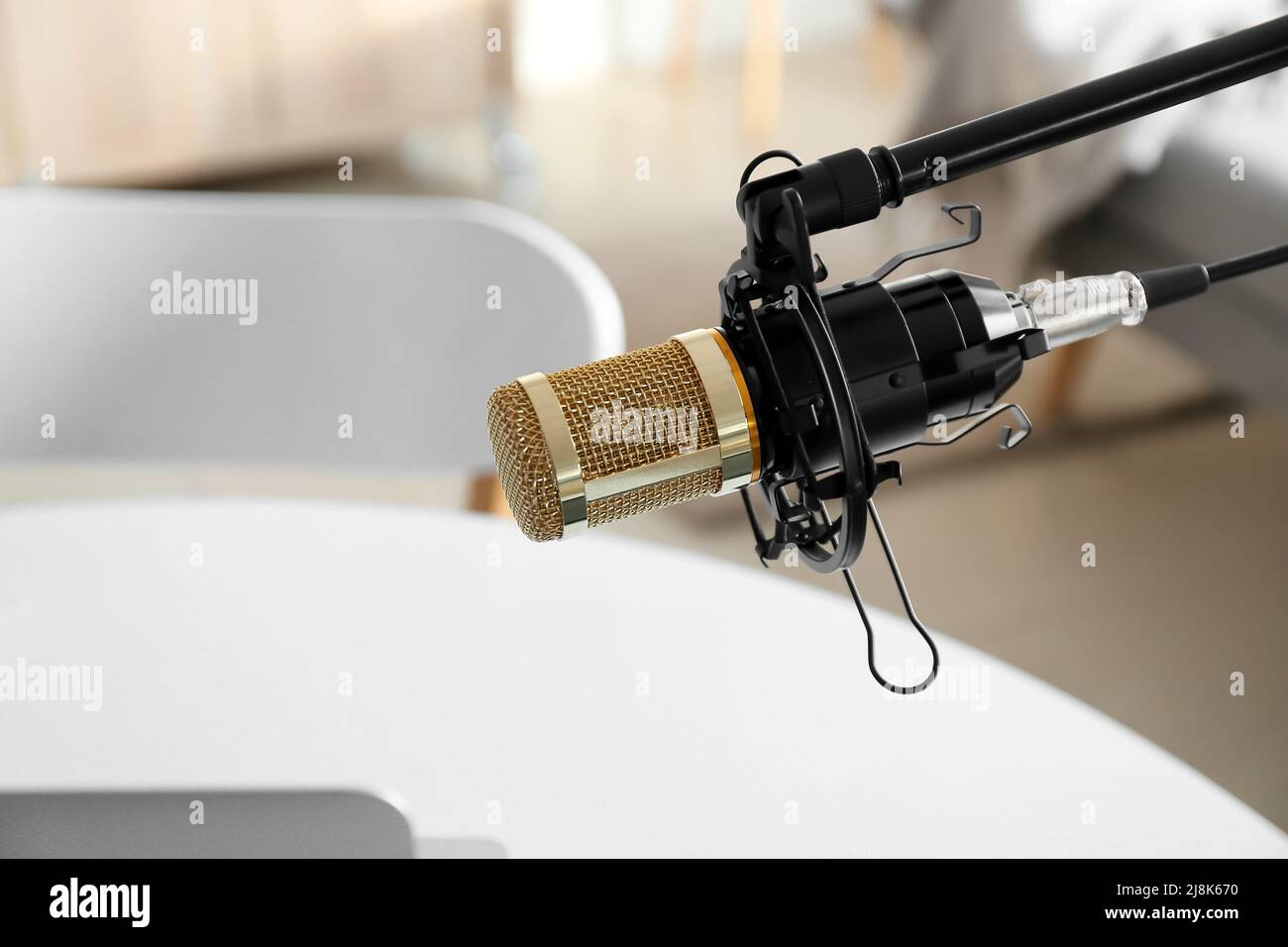 Modern microphone in light room, closeup Stock Photo - Alamy