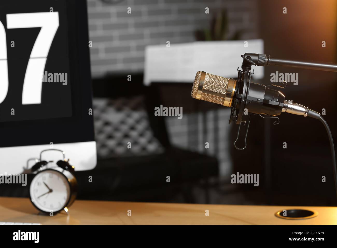 Stand with professional microphone near workplace in dark room Stock ...