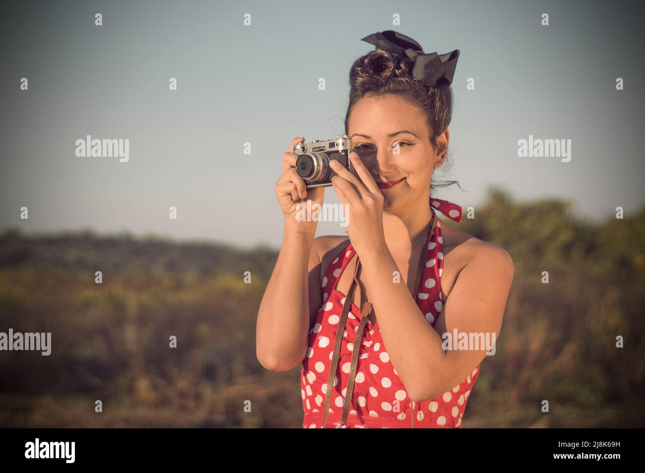 Pin-up girl in a red dress Stock Photo - Alamy