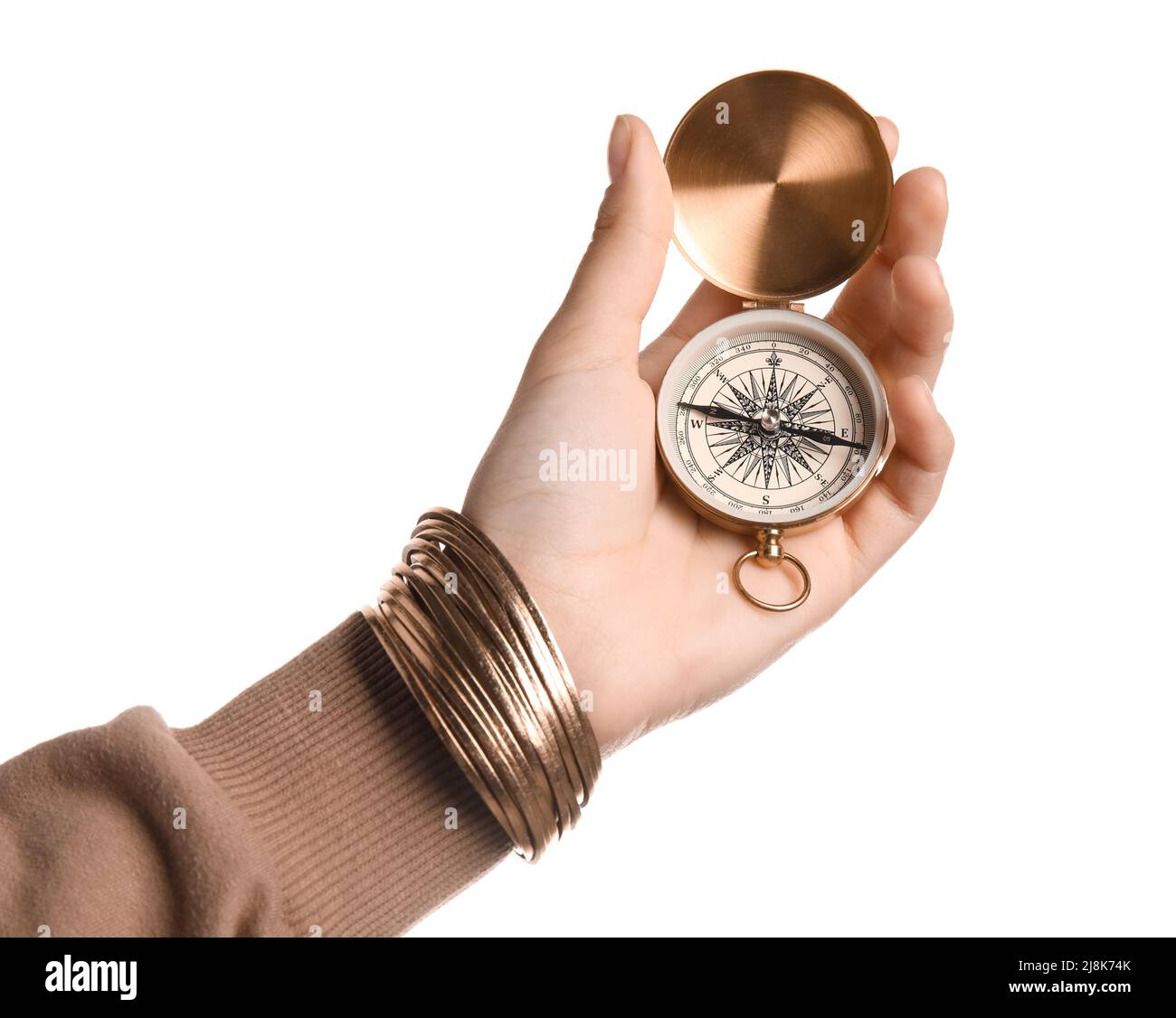 Woman with golden compass on white background Stock Photo - Alamy