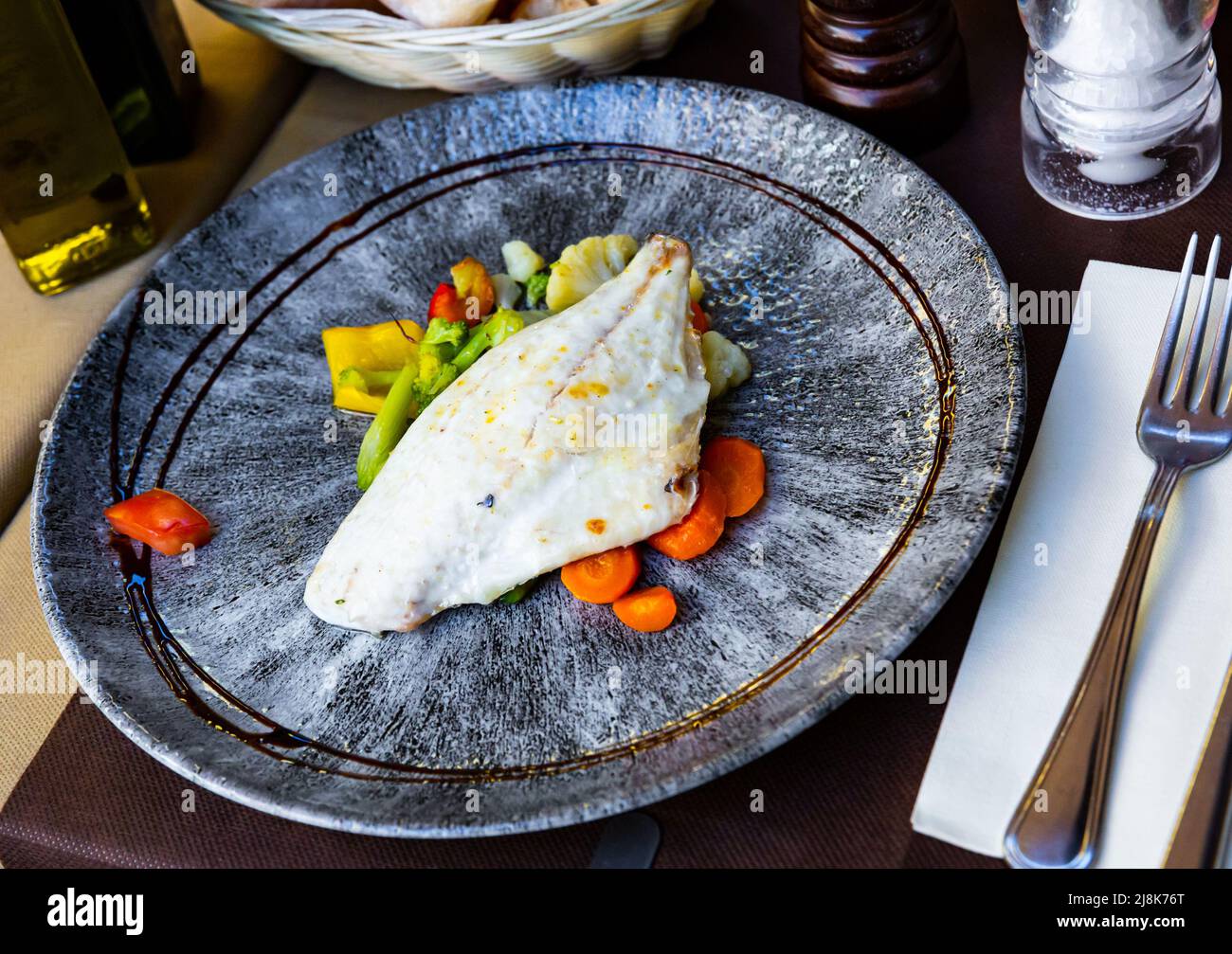 Baked dorado fish fillet with broccoli, carrot and pepper Stock Photo ...