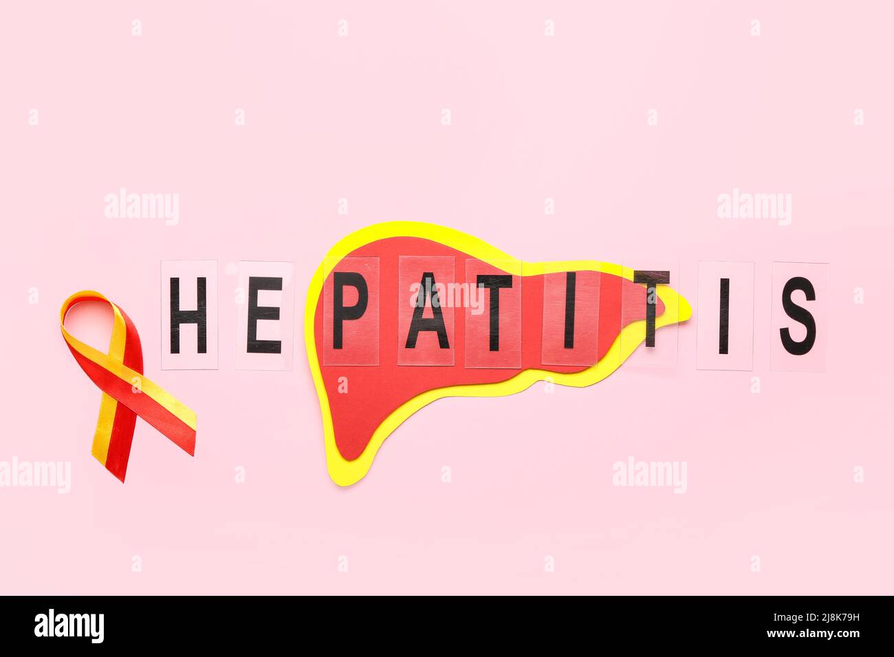 Awareness ribbon with word HEPATITIS and paper liver on pink background ...