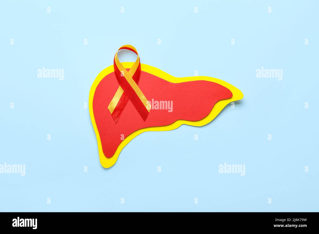 Awareness ribbon with paper liver on blue background. Hepatitis concept ...