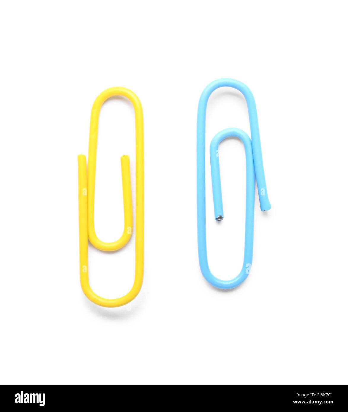 Yellow and blue paper clips on white background Stock Photo - Alamy