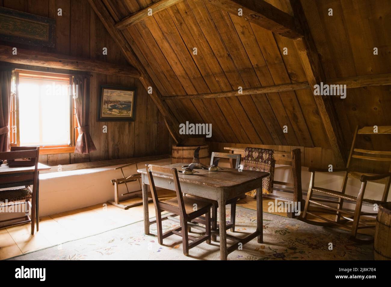 Small table and chairs in main bedroom on upstairs floor inside old ...