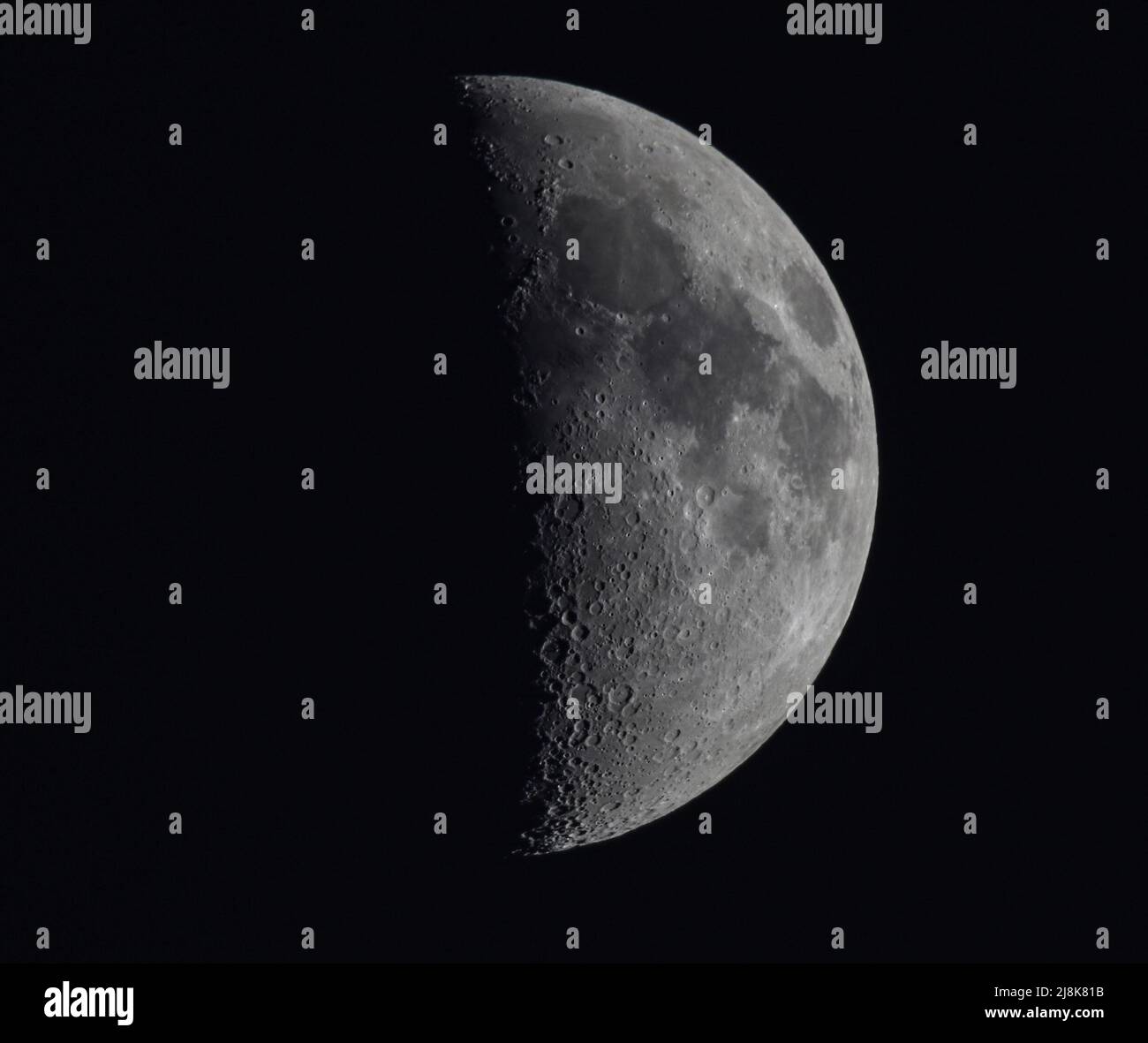 A close-up image of a Waxing Crescent Moon taken with a telescopic lens ...