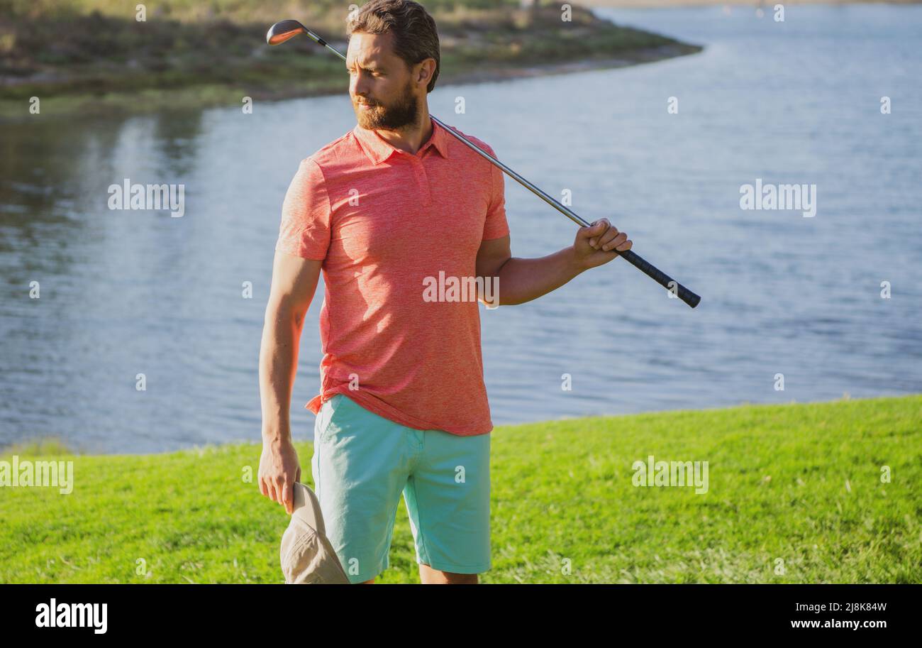Male golf player on professional golf course. Portrait of golfer man ...
