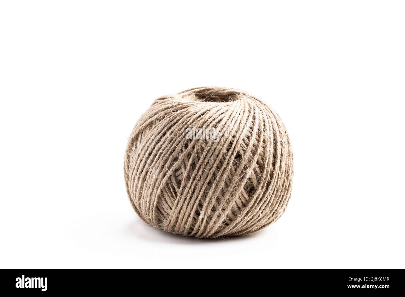 Rolled jute twine isolated on white Stock Photo - Alamy