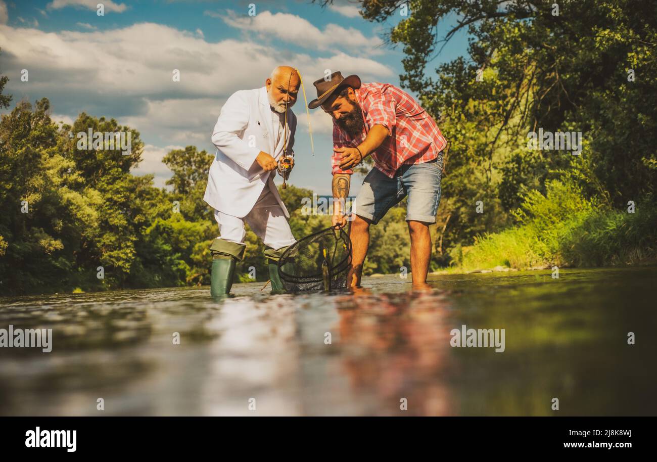 Two male friends fishing together. Fisherman with rod. Relax on nature ...