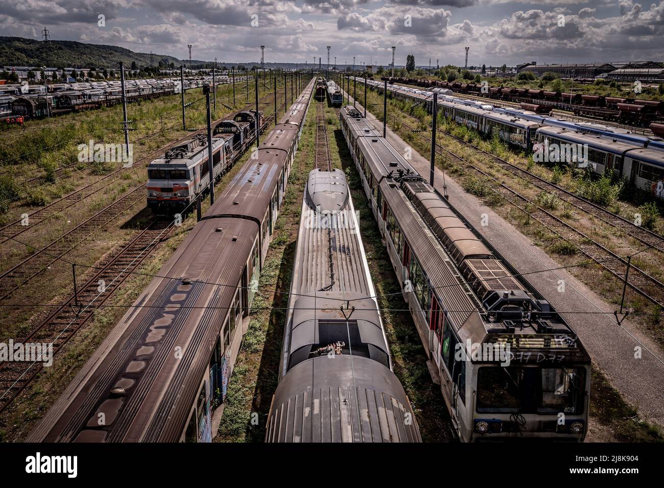 Old abandoned trains at a train graveyard in France Stock Photo - Alamy