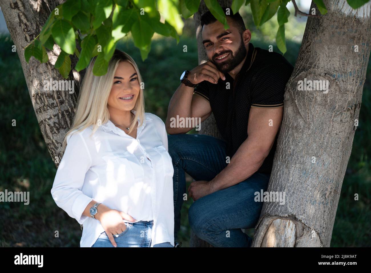 Outdoor Portrait of Young Beautiful Happy Smiling Couple Where Girl is ...