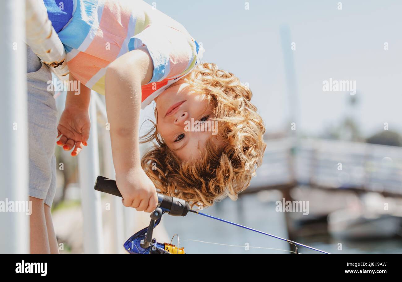 Fishing hobby. Boy with spinner at jetty. Kid with rod Stock Photo - Alamy