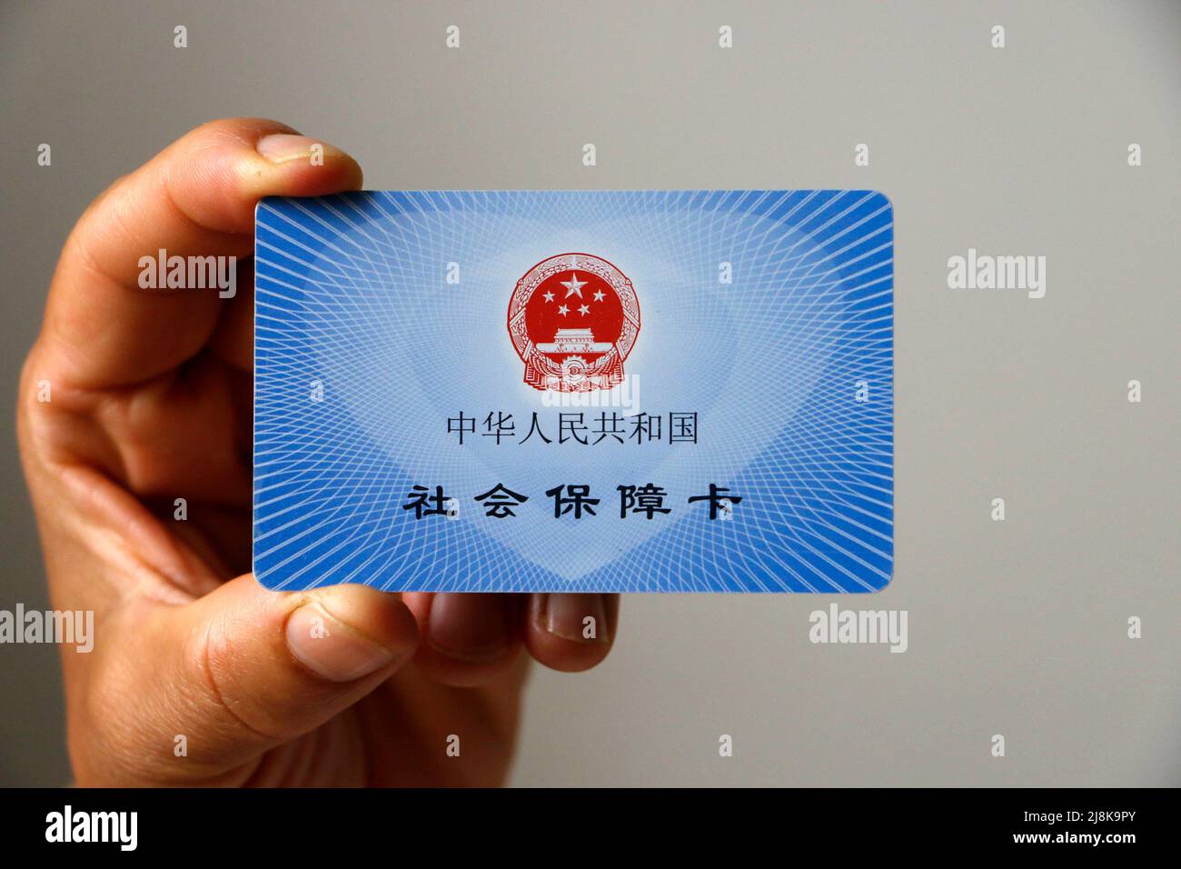 BEIJING, CHINA - MAY 5, 2022 - A resident shows a social security card ...