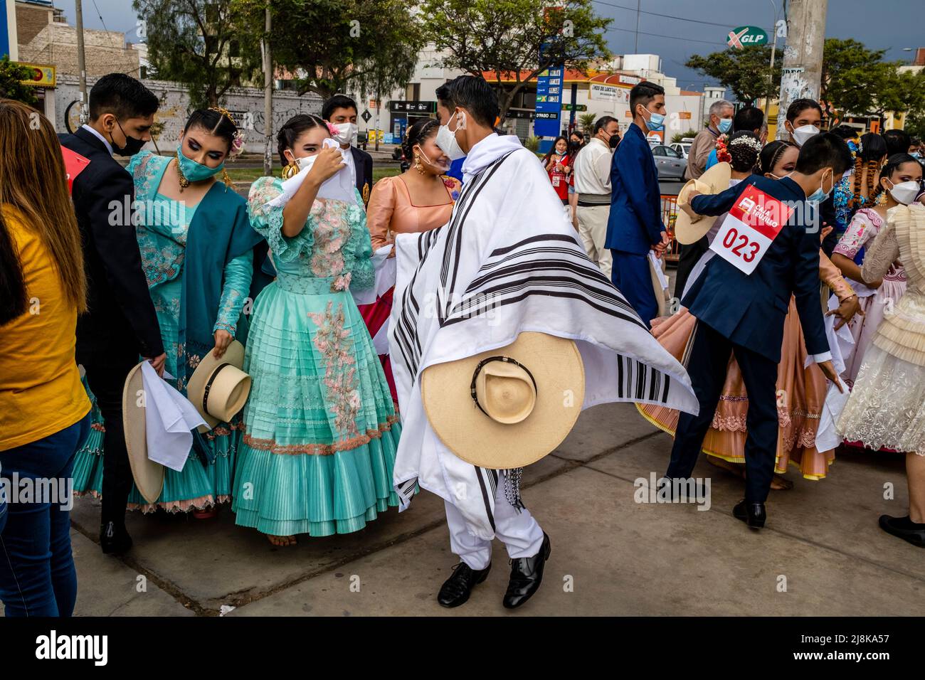 Young Peruvian Dancers In Costume Wait To Take Part In A Marinera Dance