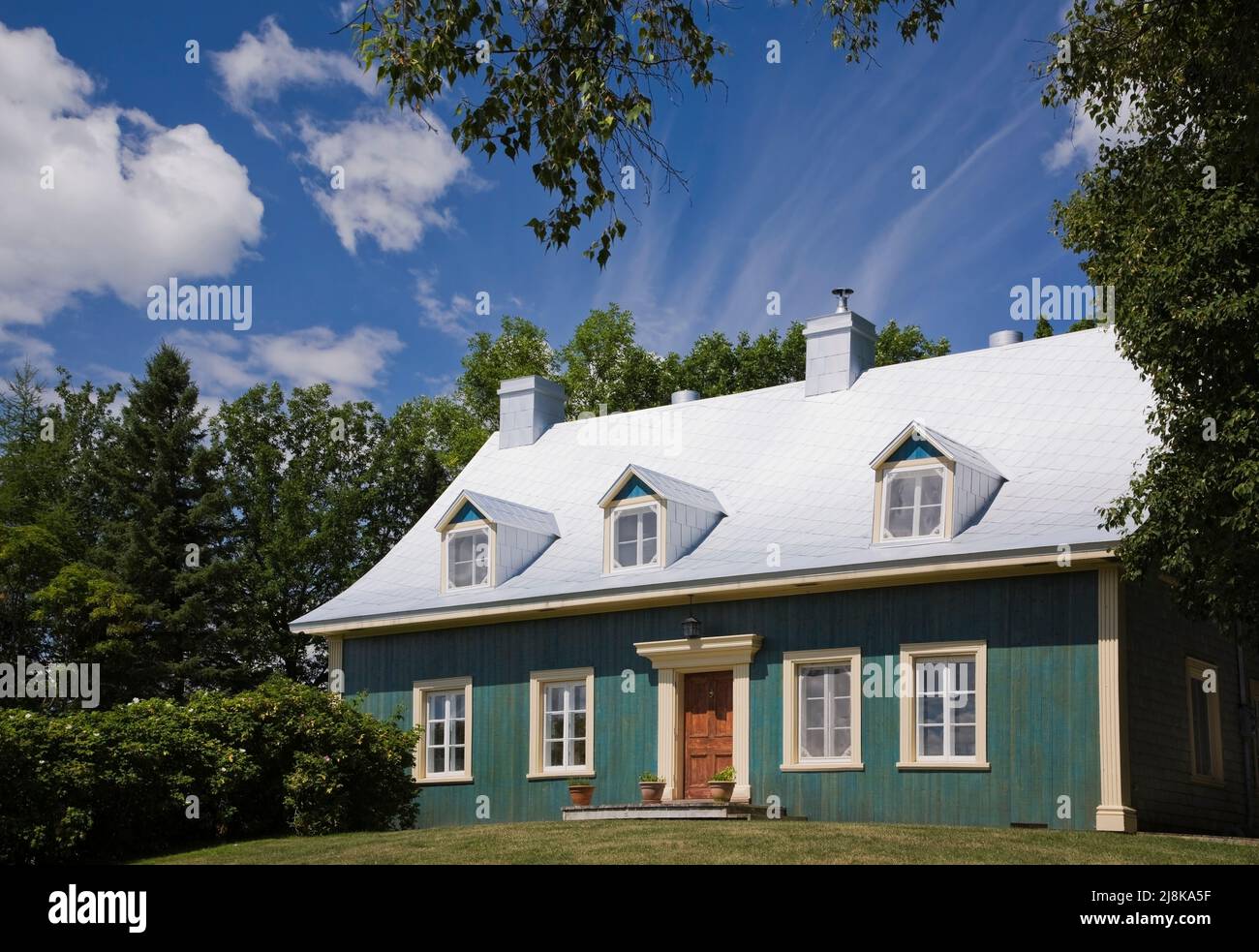 Old circa 1786 Canadiana cottage style home facade with turquoise wood ...