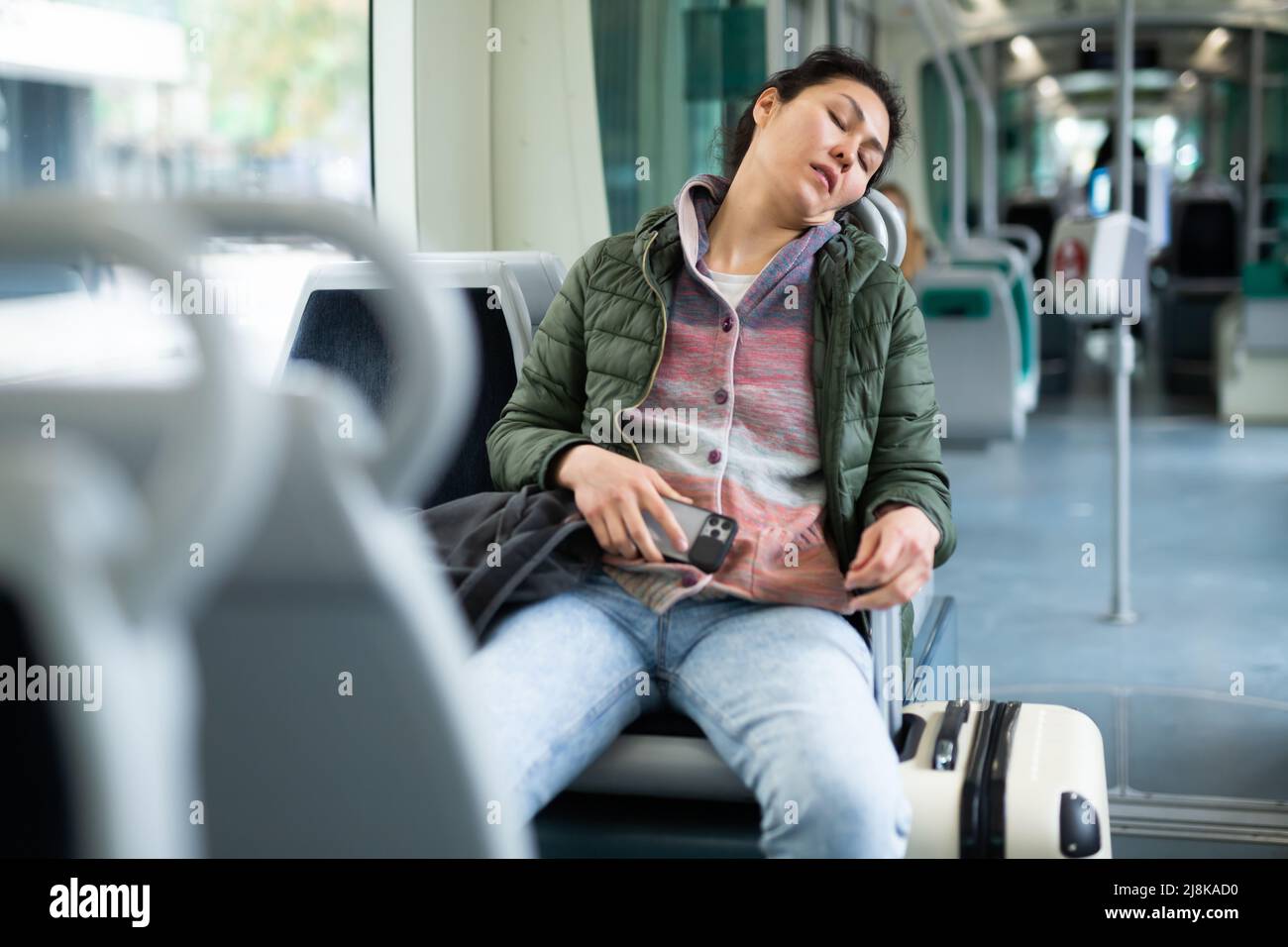 Woman sleeping bus public hi-res stock photography and images - Alamy