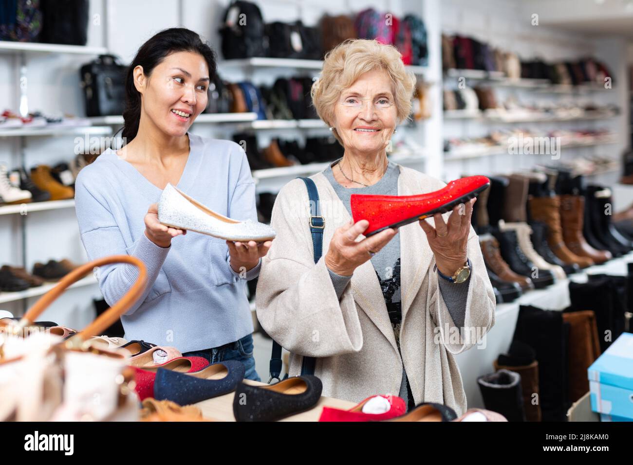Woman senior buying shoes hi-res stock photography and images - Alamy